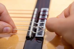 Restringing an Acoustic Guitar: How Much Does It Cost? - Tone Man